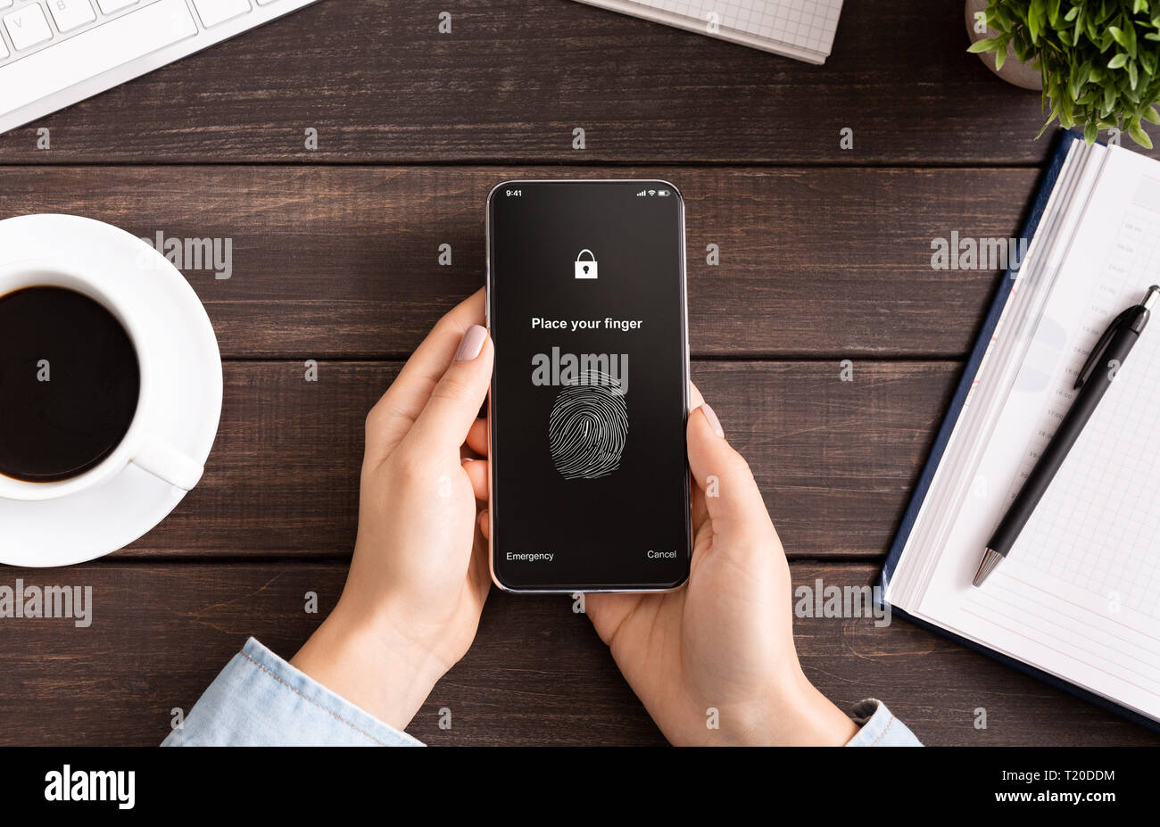 Cyber security of personal device. Woman using modern cellphone with ...