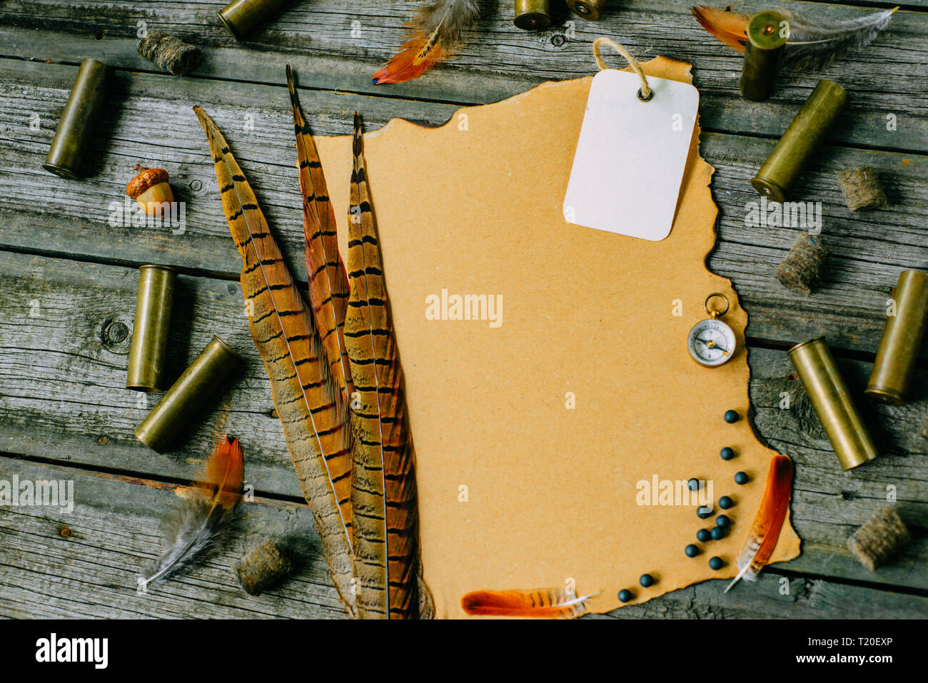 Vintage paper for information with pheasant feather and cartridges on ...