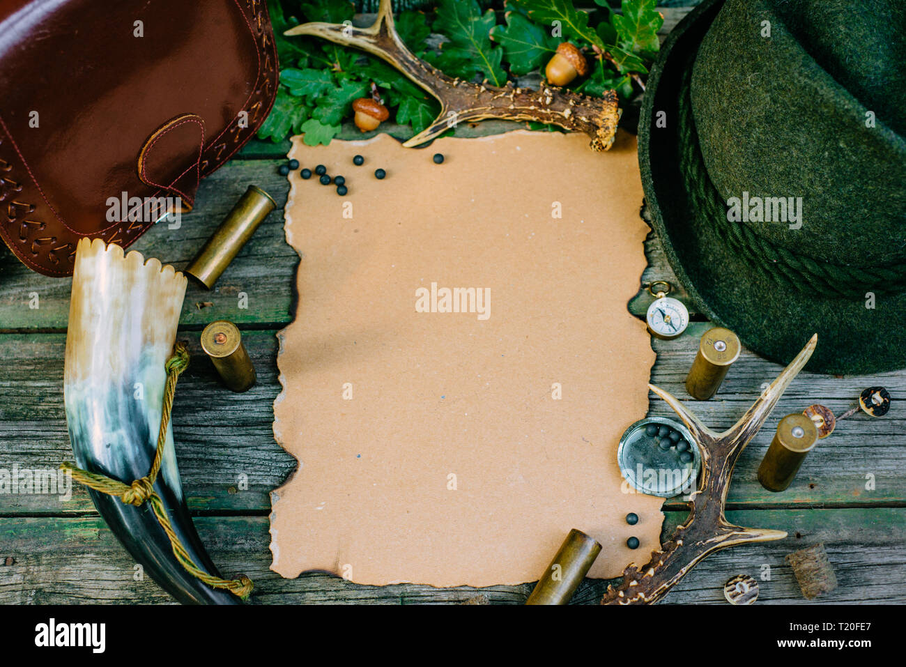 Paper for information on old wooden background and deer horn, huntsman ...