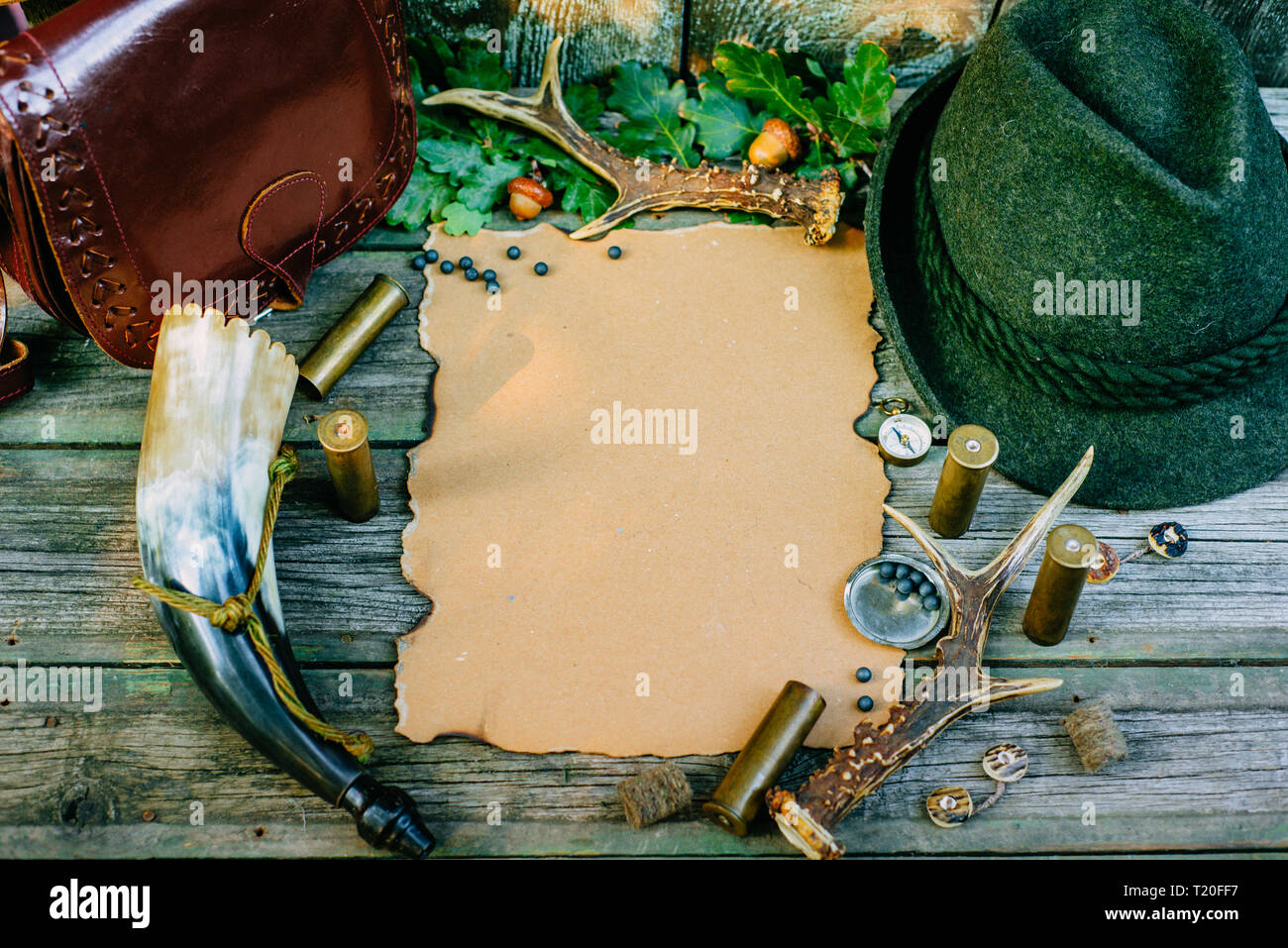 Paper for information on old wooden background and deer horn, huntsman ...