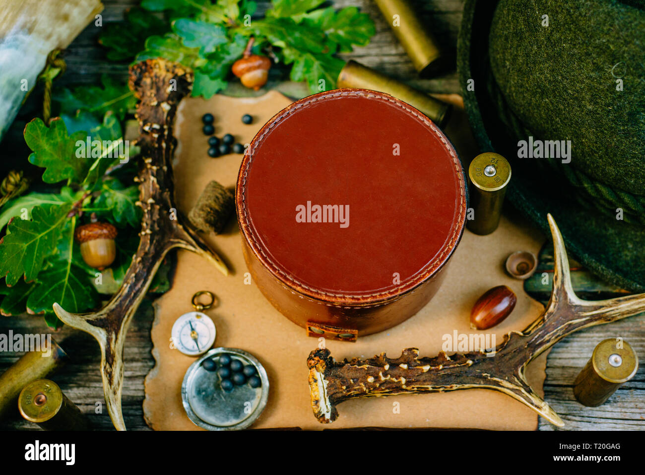 Closeup round leather hunt box for information among hunting or tourist ...