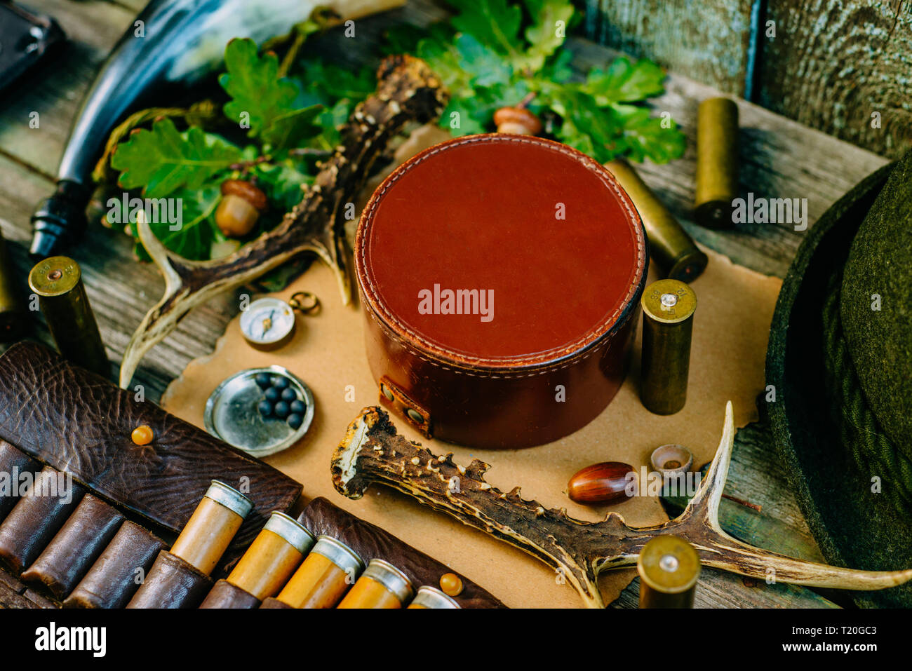 Closeup round leather hunt box for information among hunting or tourist ...