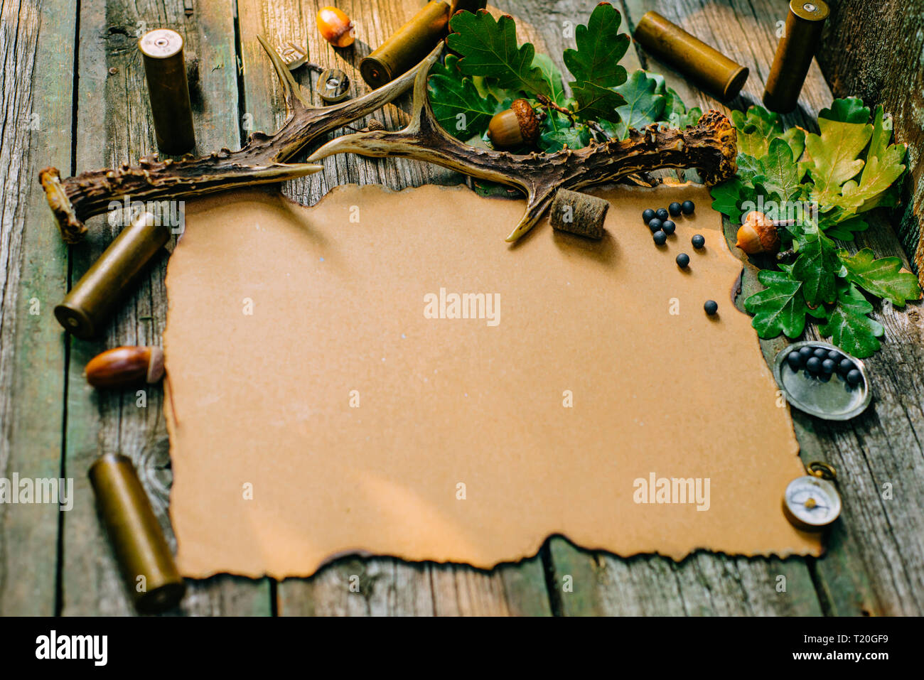 Closeup vintage sheet of paper with hunting equipment from left side on ...