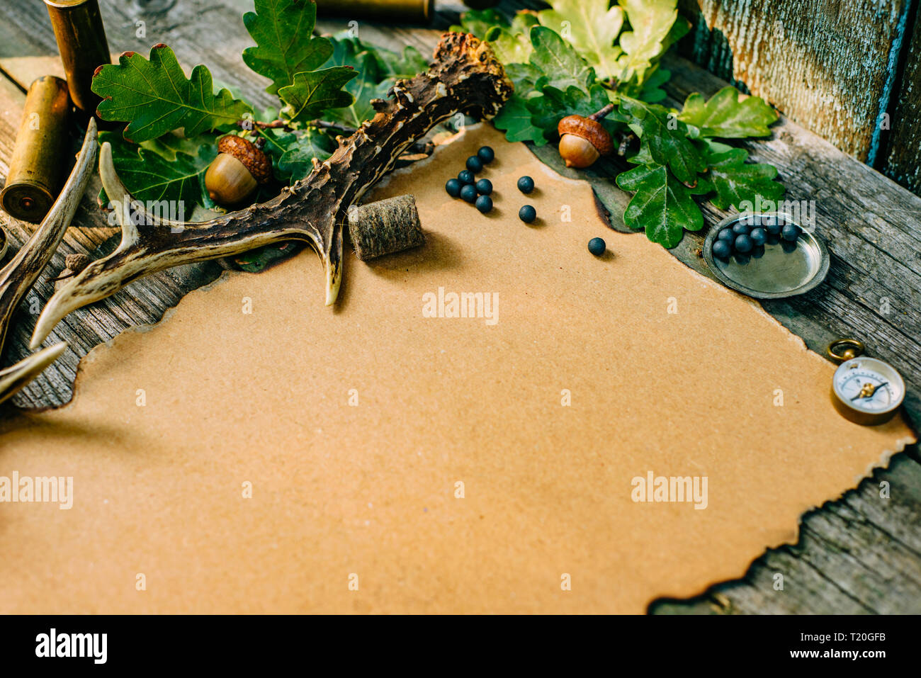 Closeup vintage sheet of paper with hunting equipment from left side on ...