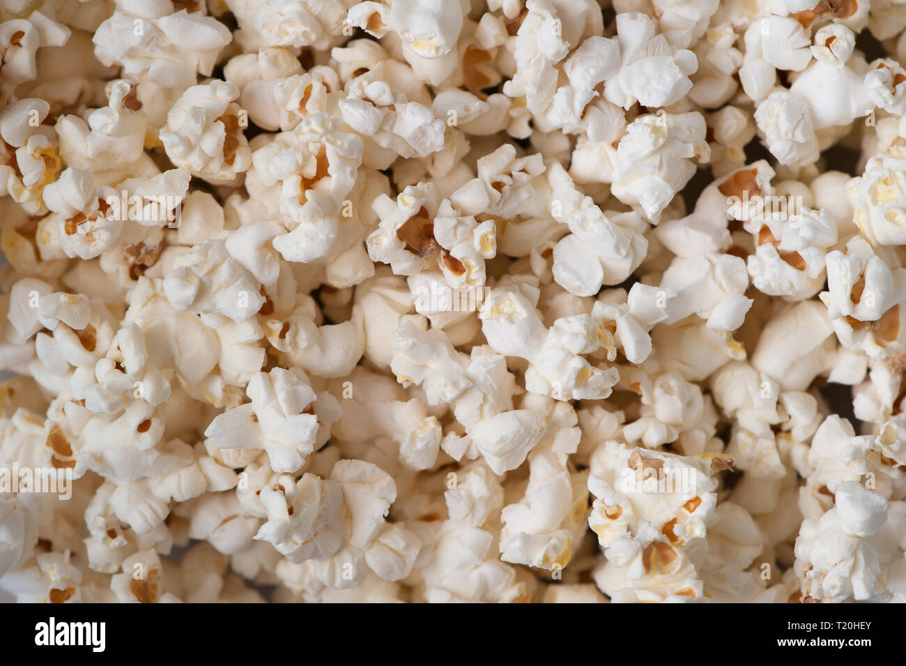 Scattered simple popcorn, texture background Stock Photo - Alamy