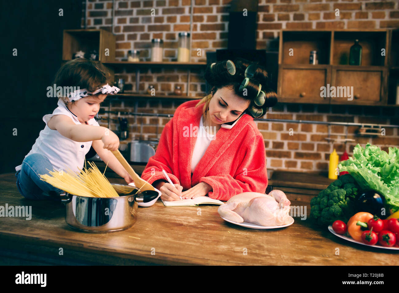 Stressed mum at home. Young mother with little child in the home ...