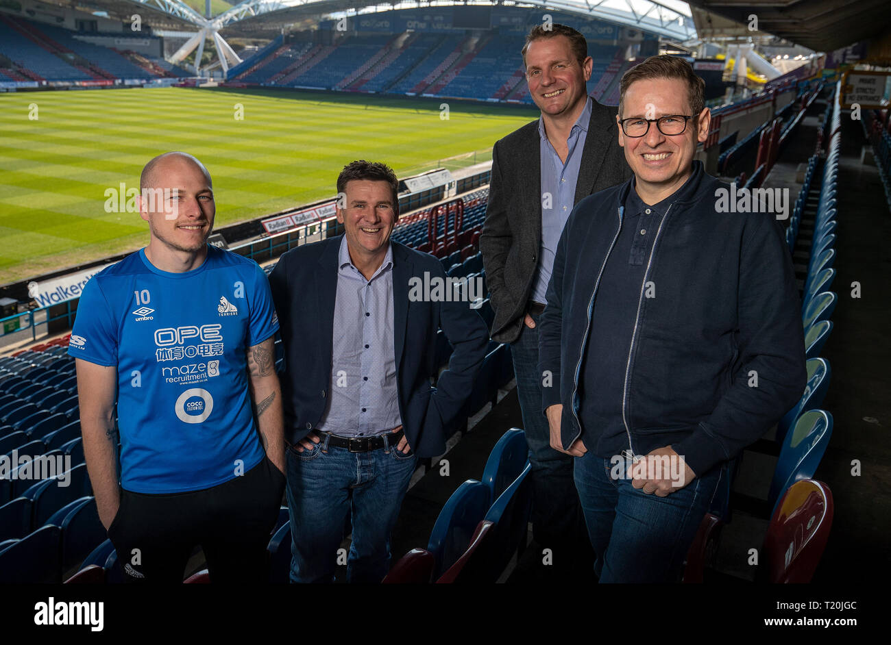 Huddersfield Town's Aaron Mooy (left) with Lion Global Markets managing ...