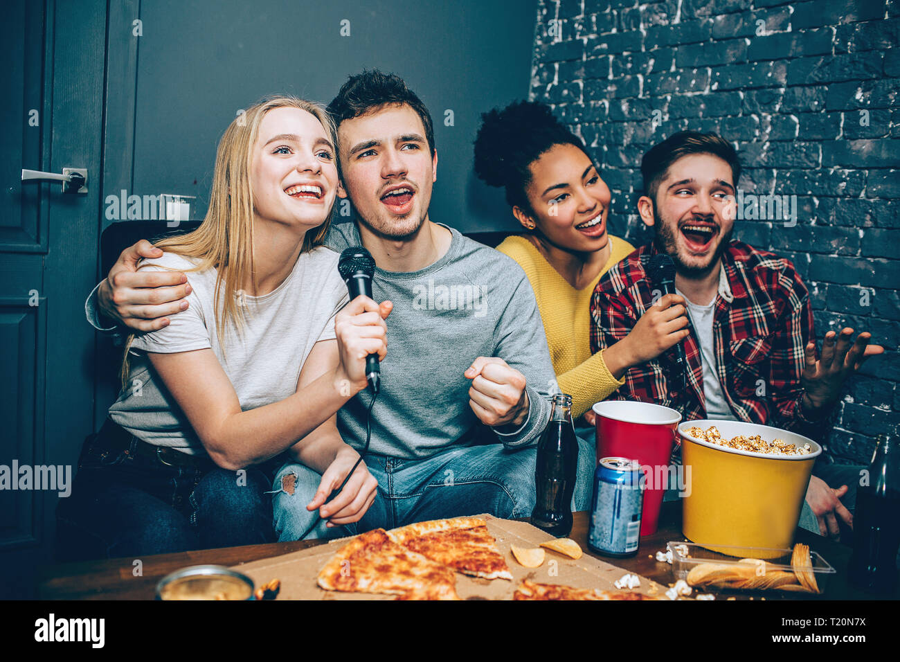 Cute picture of four people singing a song in pairs. Students are ...
