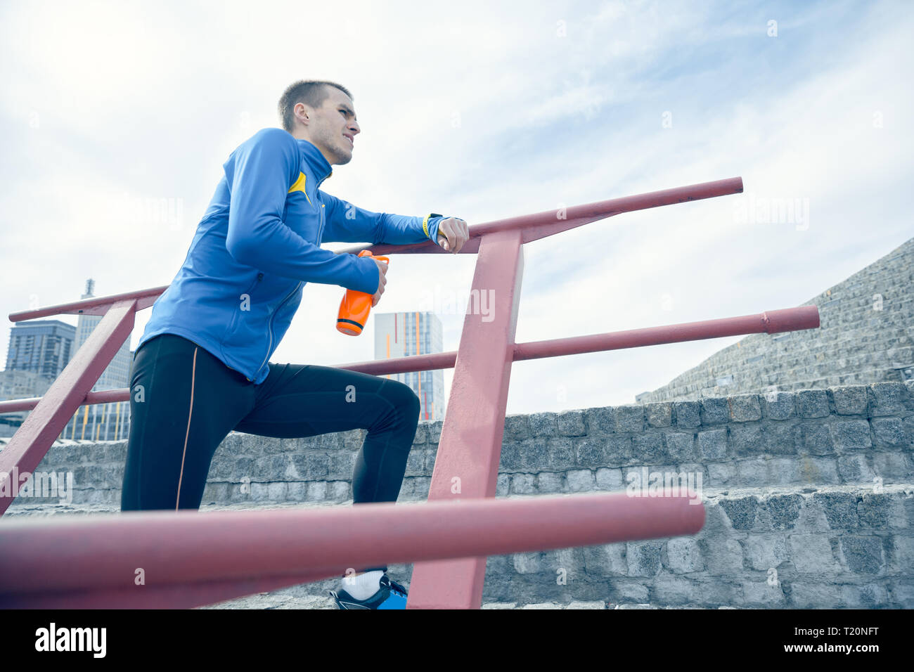 Man resting after running on city background at morning. Healthy ...