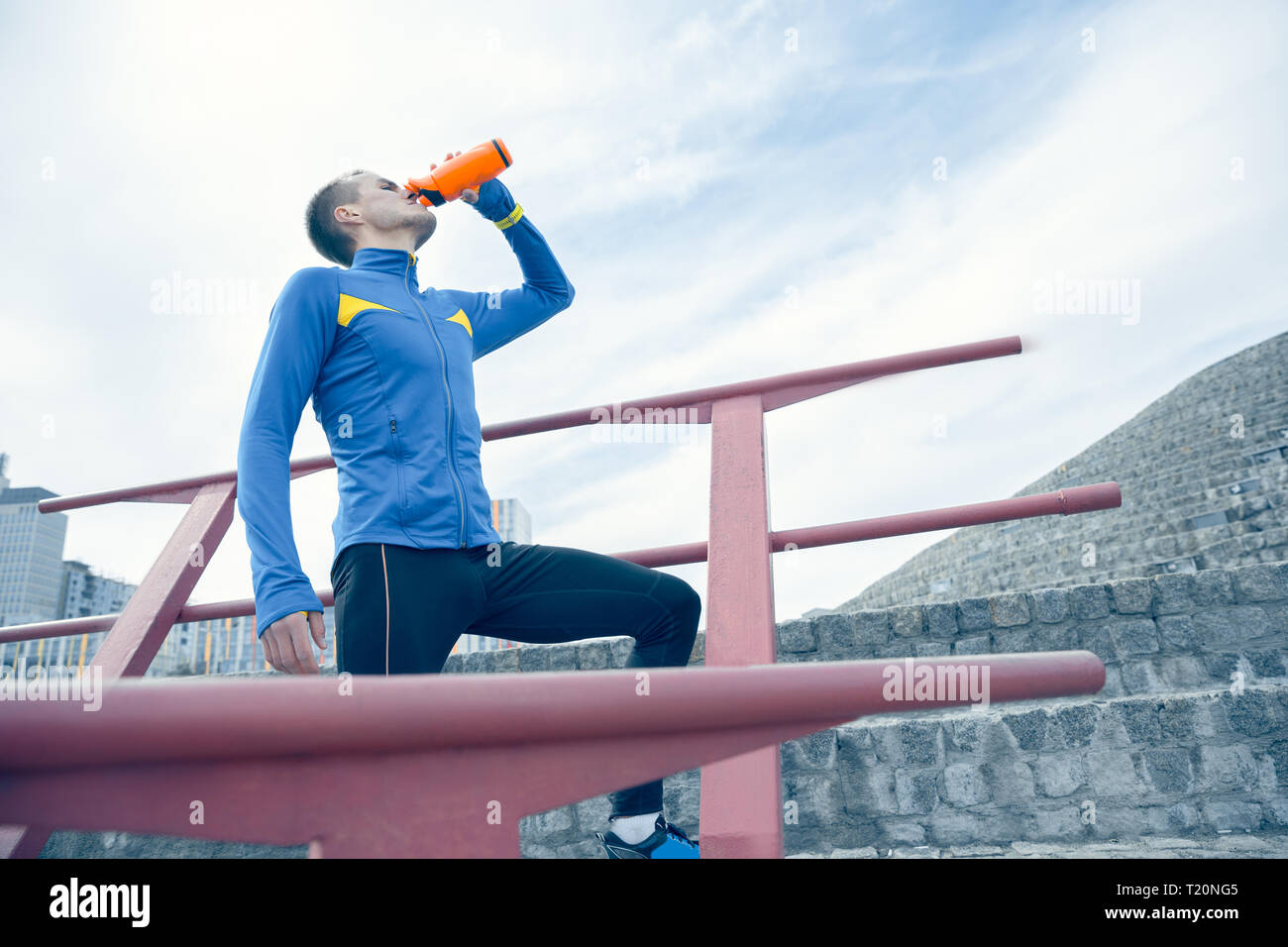 Man resting after running on city background at morning. Healthy ...