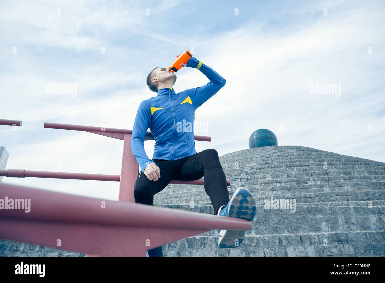 Man resting after running on city background at morning. Healthy ...