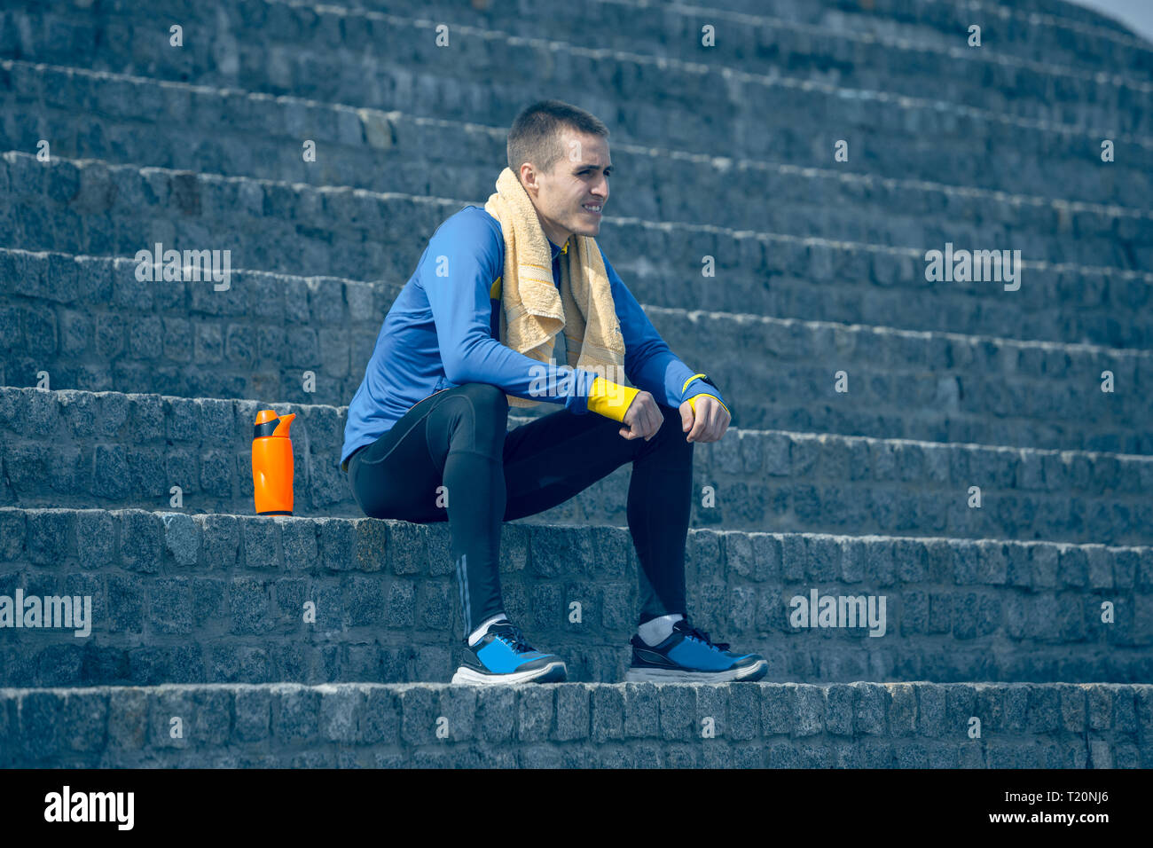Man resting after running on city background at morning. Healthy ...