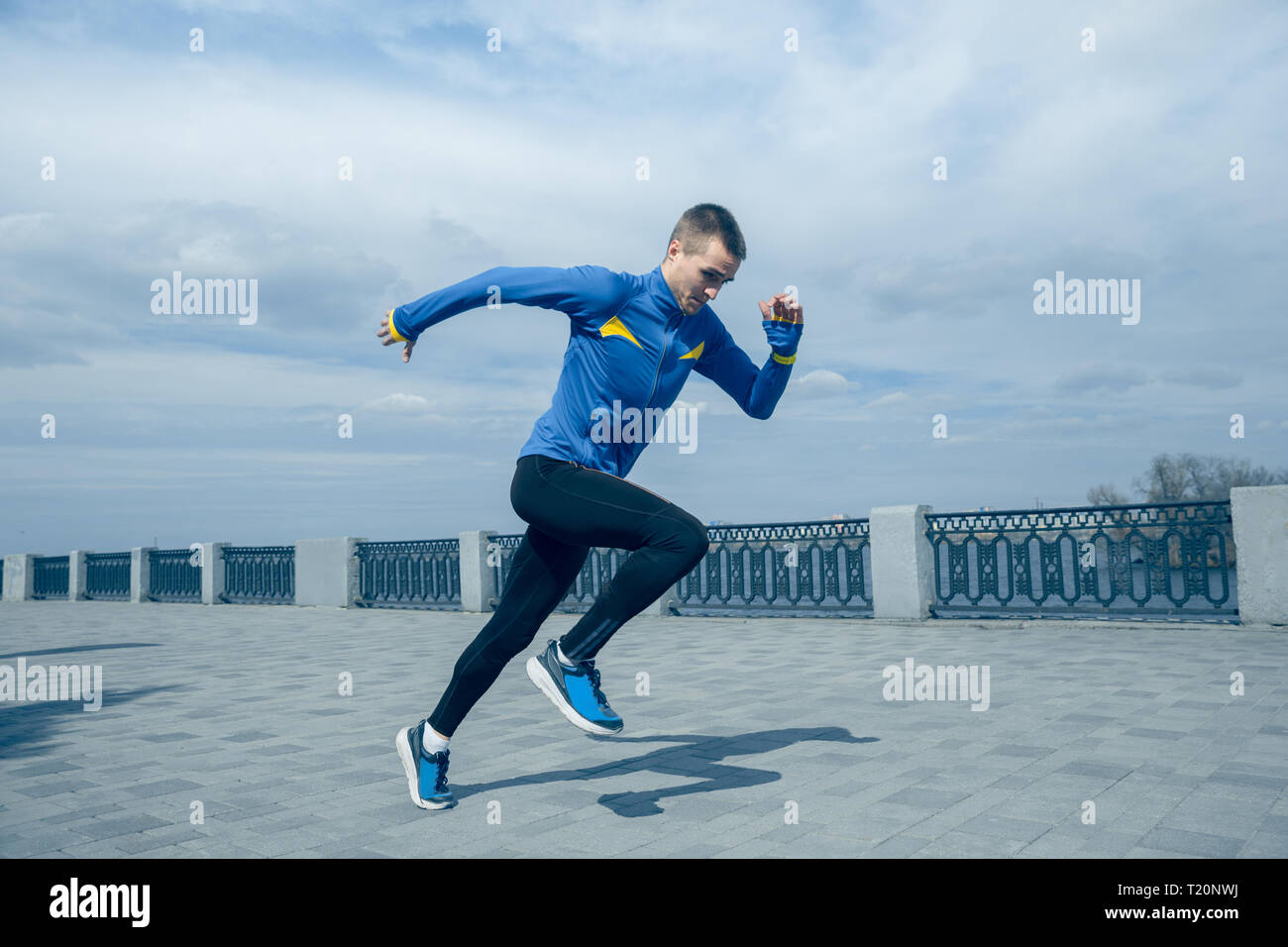 Man running on city background at morning. Healthy lifestyle concept ...