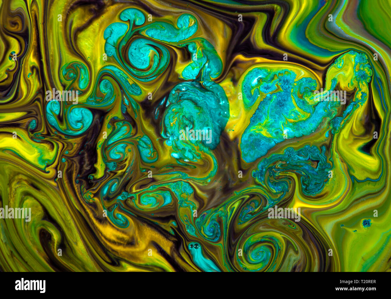 Abstract colored yellow and green acrylic paints. View of macro world ...