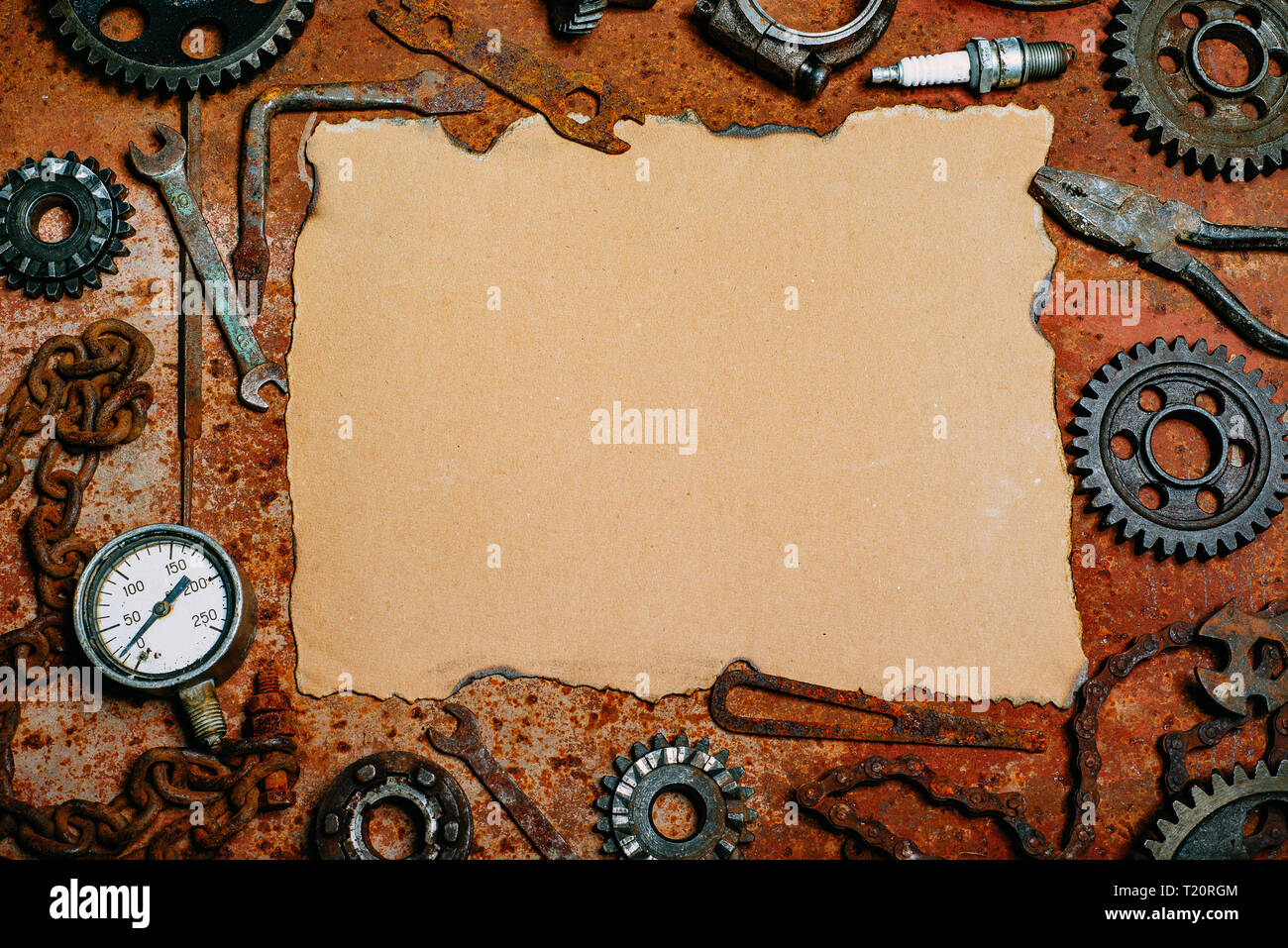 Vintage paper in the center of tools on old metal background ...