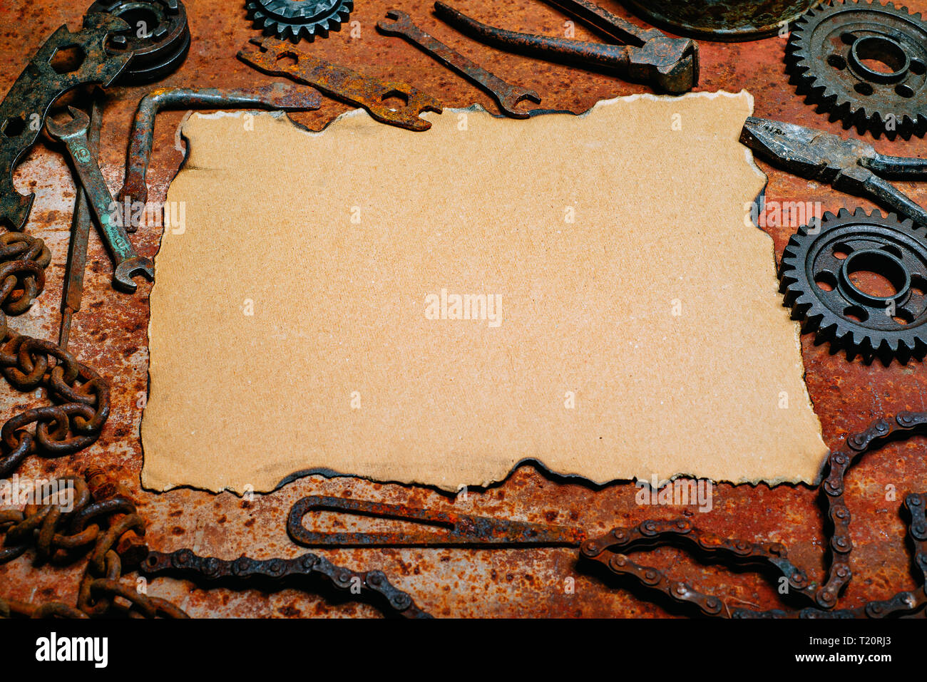 Vintage paper in the center tools on old metal background. Motorcycle ...