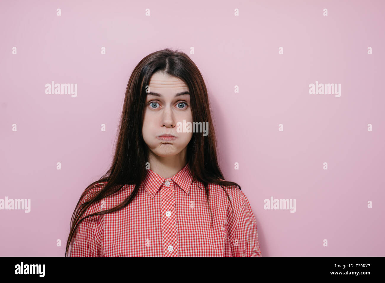 Woman blowing cheeks hi-res stock photography and images - Alamy