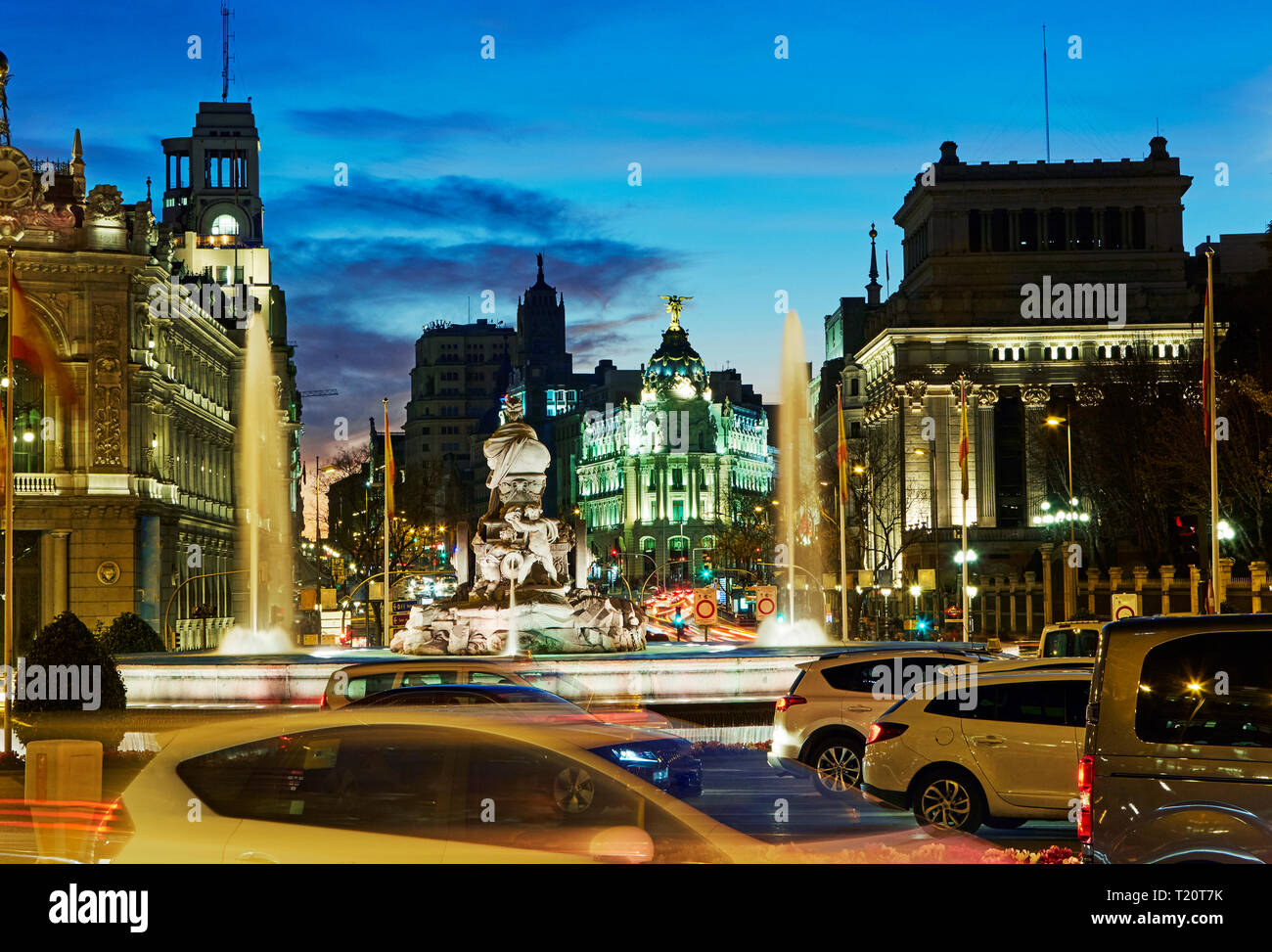 Plaza de la Cibeles (Cibeles Square) illuminated at dusk with the ...