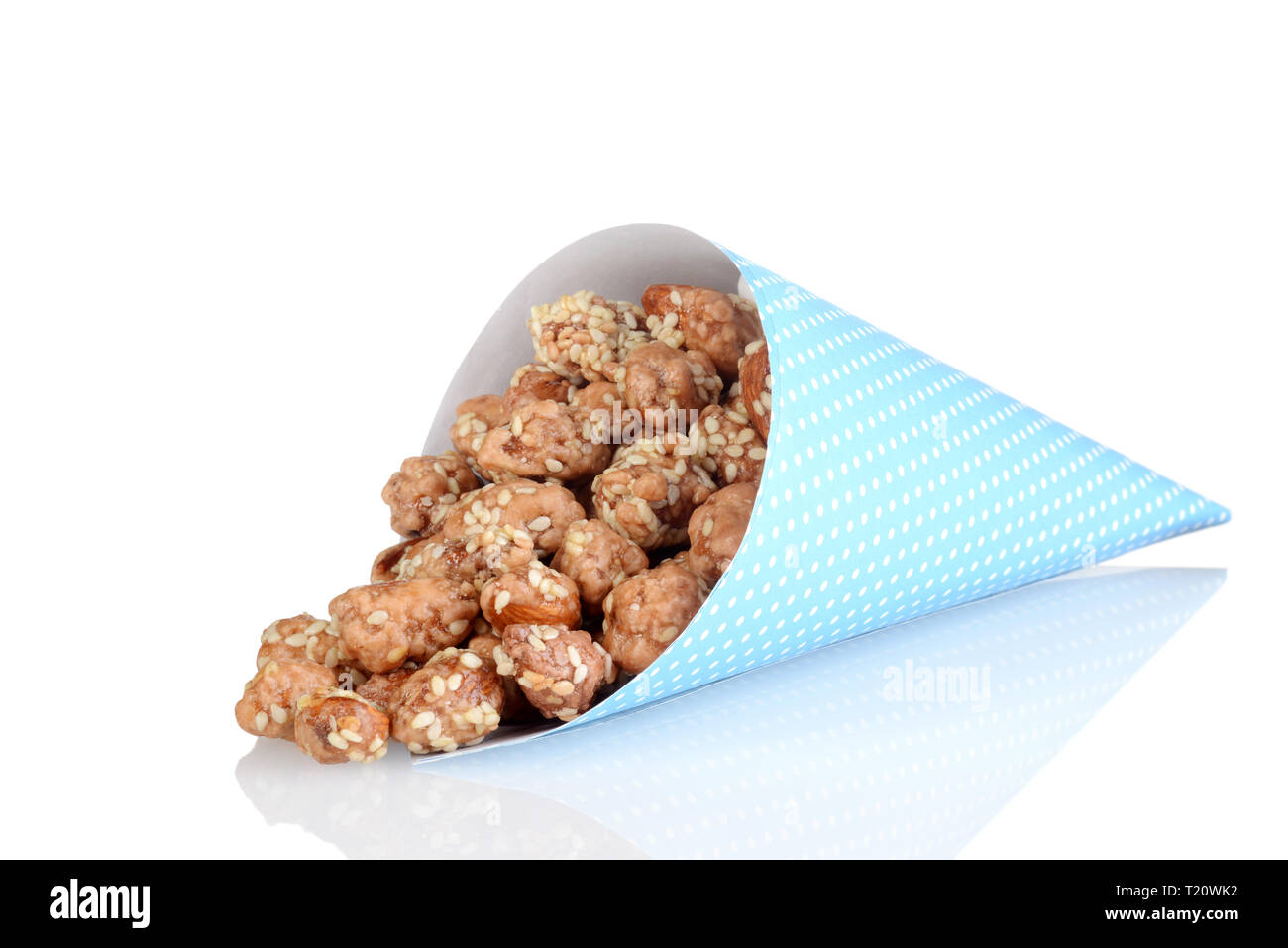 blue paper cone of honey sesame seed almonds Stock Photo - Alamy