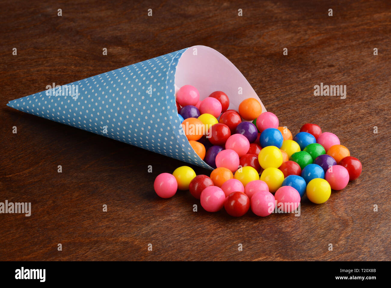 colorful bubble gumballs in a blue paper cone Stock Photo - Alamy