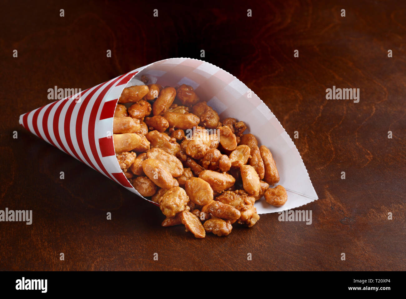 red and white cone with honey covered peanuts Stock Photo - Alamy
