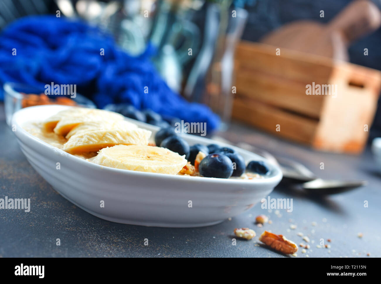 oat flakes with milk, fresh blueberry, nuts Stock Photo - Alamy