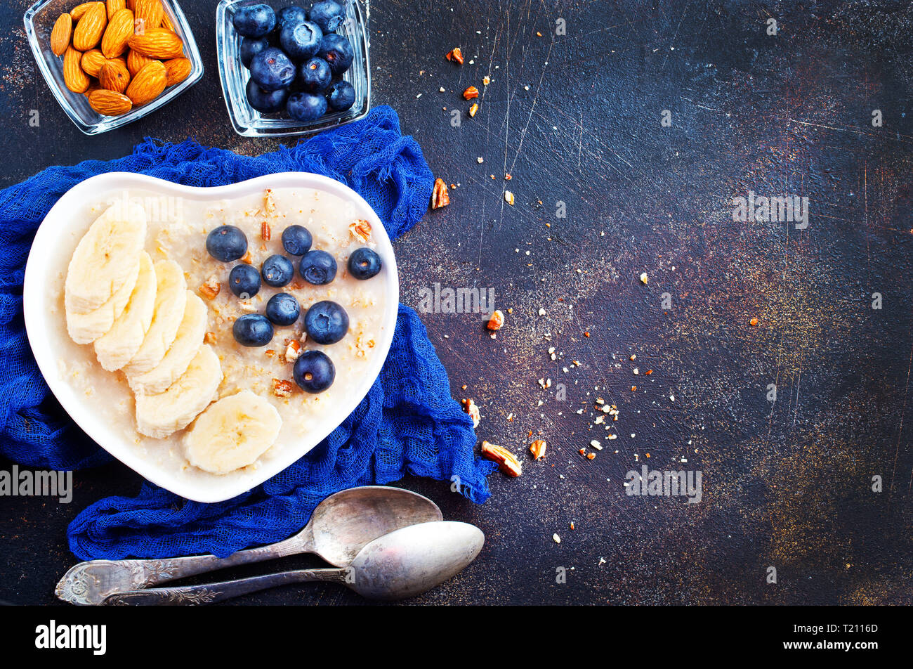 oat flakes with milk, fresh blueberry, nuts Stock Photo - Alamy