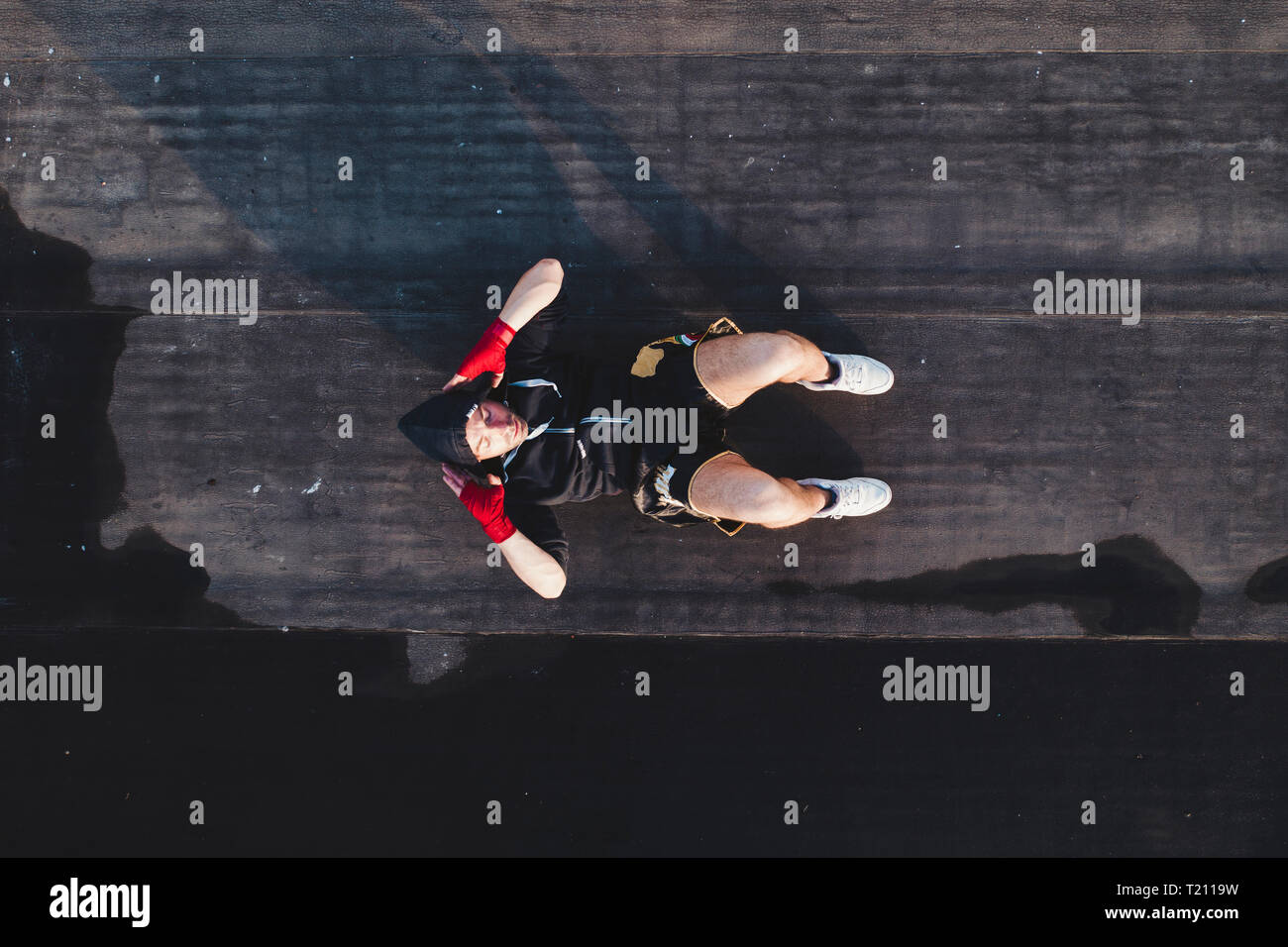 Boxer doing sit-ups outdoors Stock Photo - Alamy