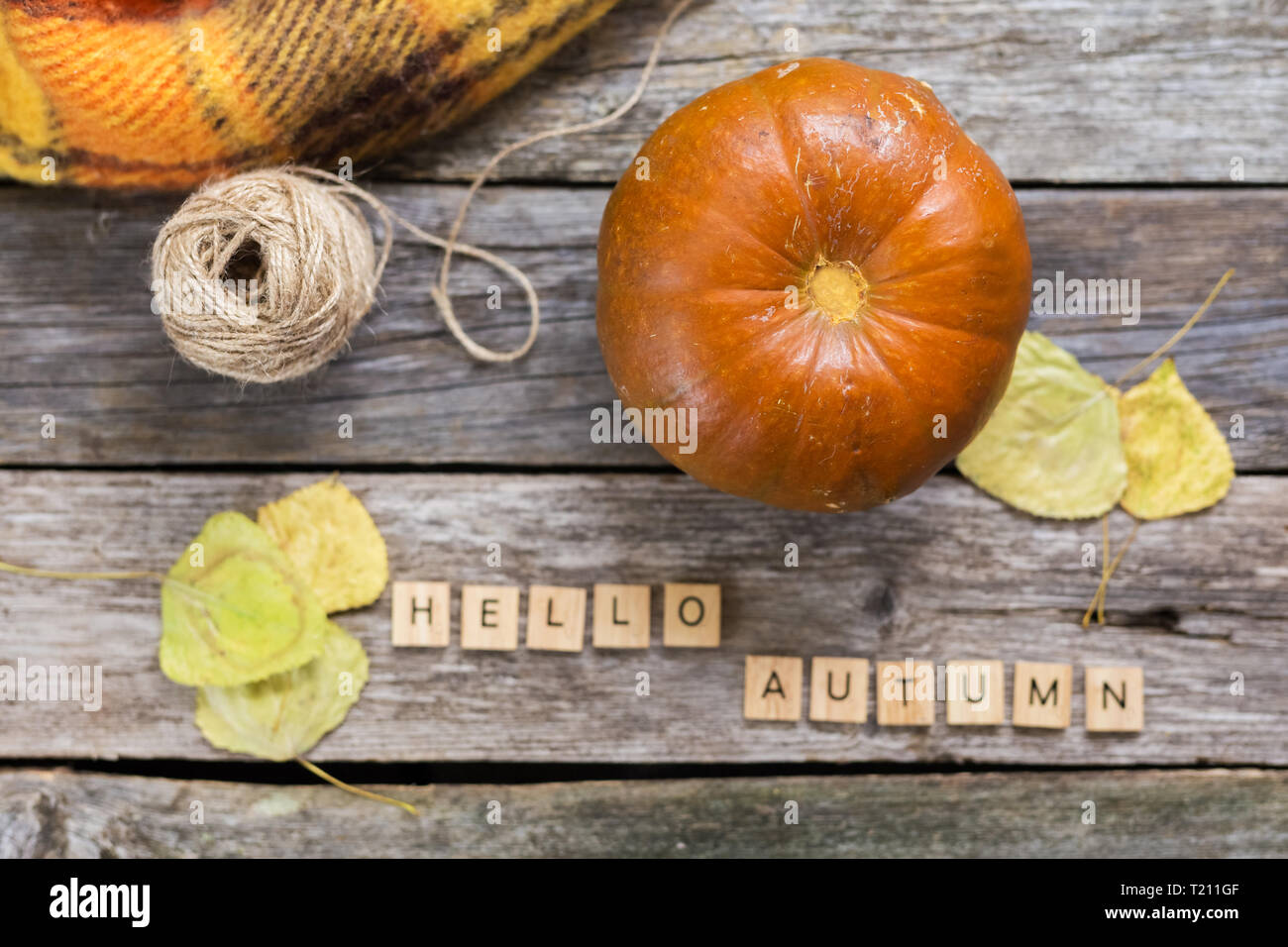 Autumn fall flat lay, top view. Fall leaves, with inscription hello ...