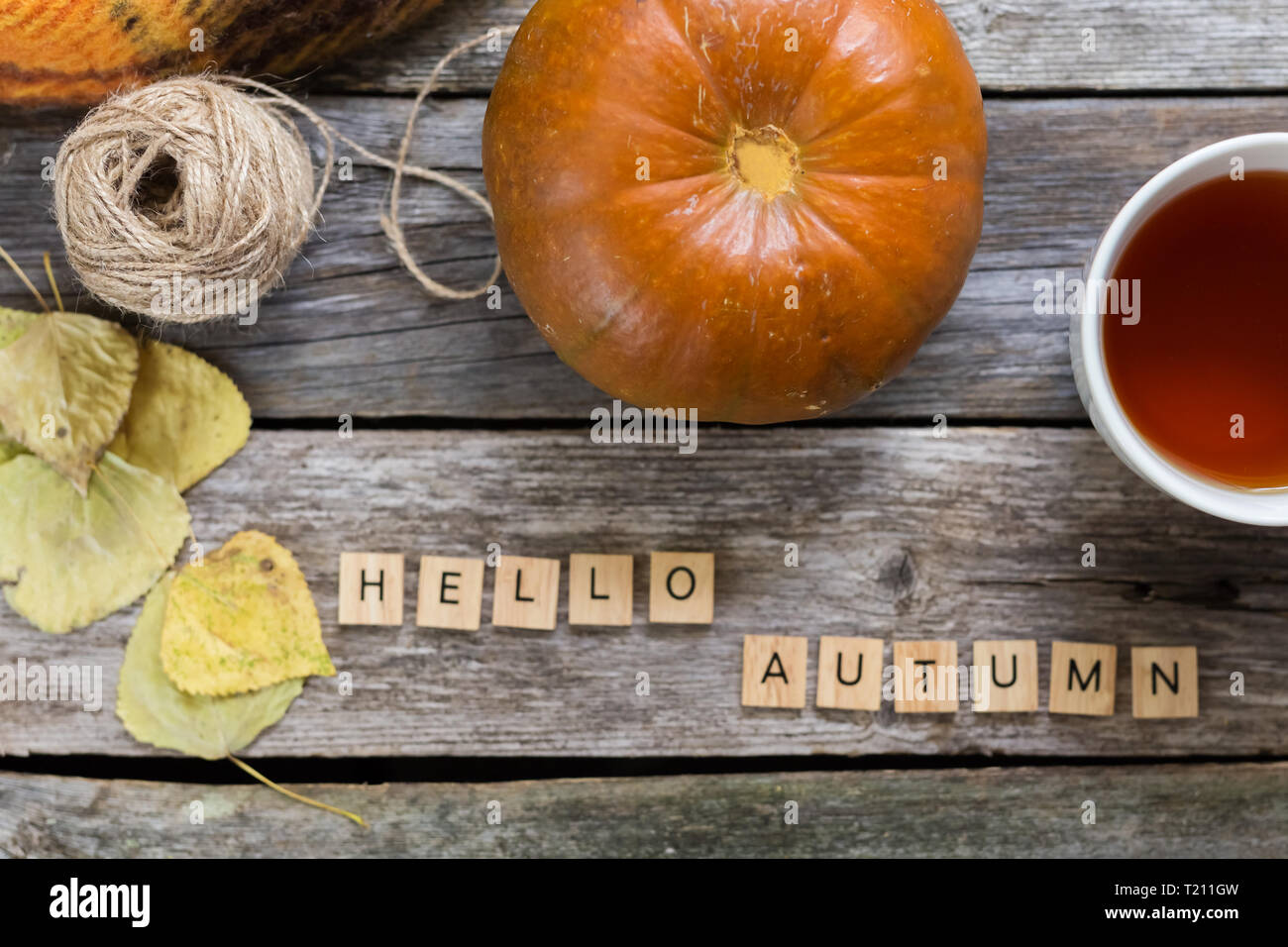 Autumn fall flat lay, top view. Fall leaves, with inscription hello ...