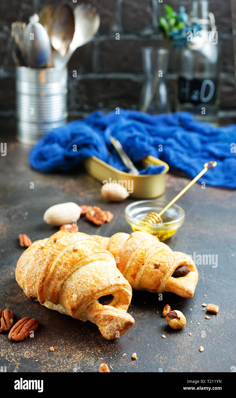 sweet croissant with chocolate and nuts, croissant for breakfast Stock ...