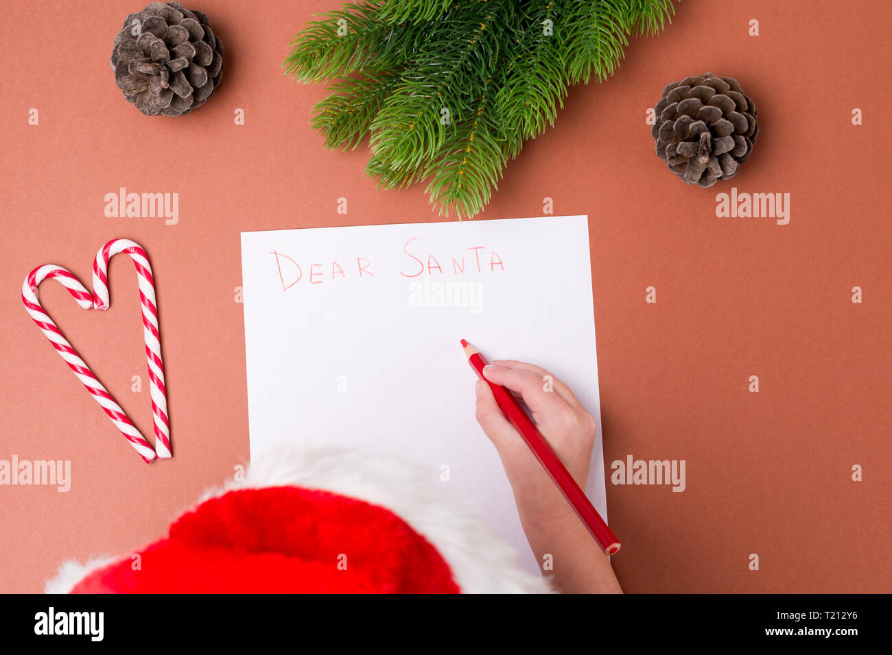 Christmas Concept Letter For Santa Boy Hands On Paper Christmas christmas-concept-letter-for-santa-boy-hands-on-paper-christmas