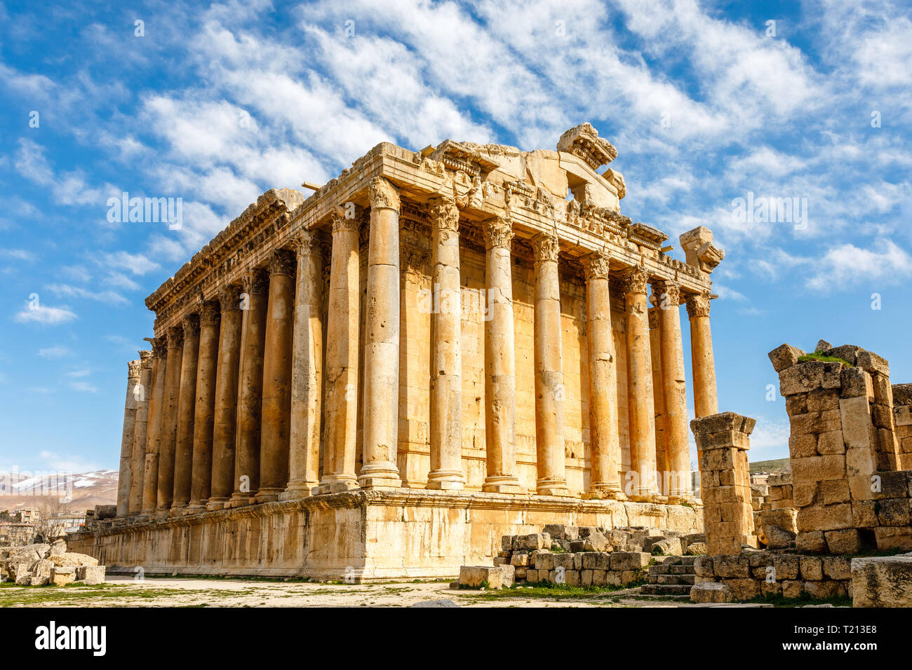 Ancient Roman temple of Bacchus with surrounding ruins with blue sky in ...