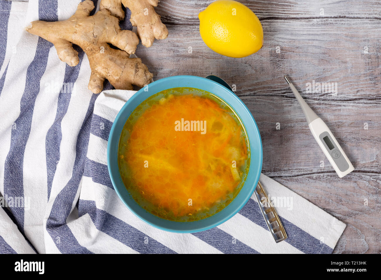 Health concept. Bowl of fresh chicken homemade soup to cure flu ...