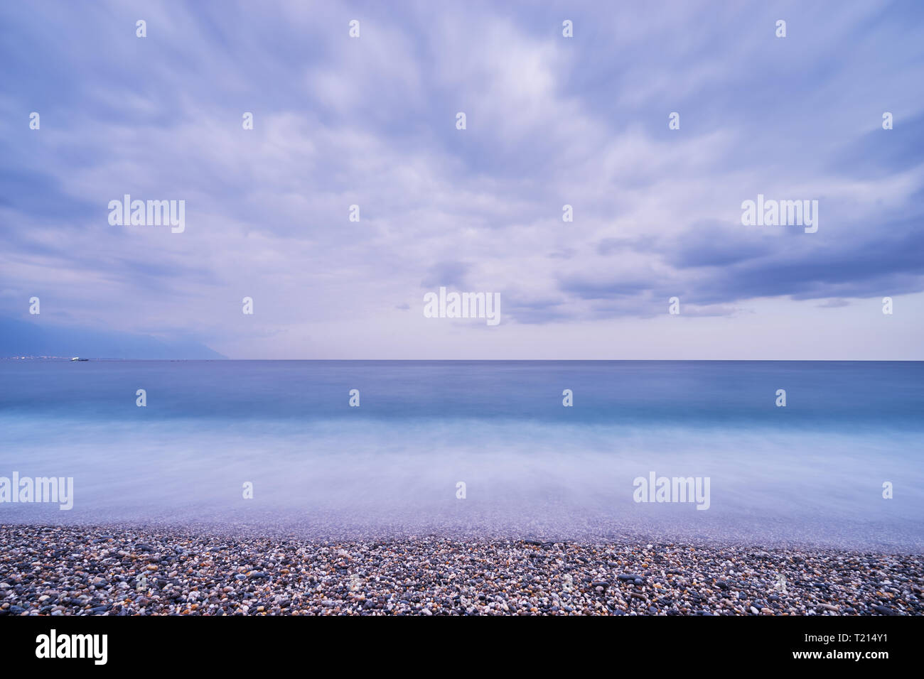 Beautiful scenic of ocean with sprawling stone covered beach at ...