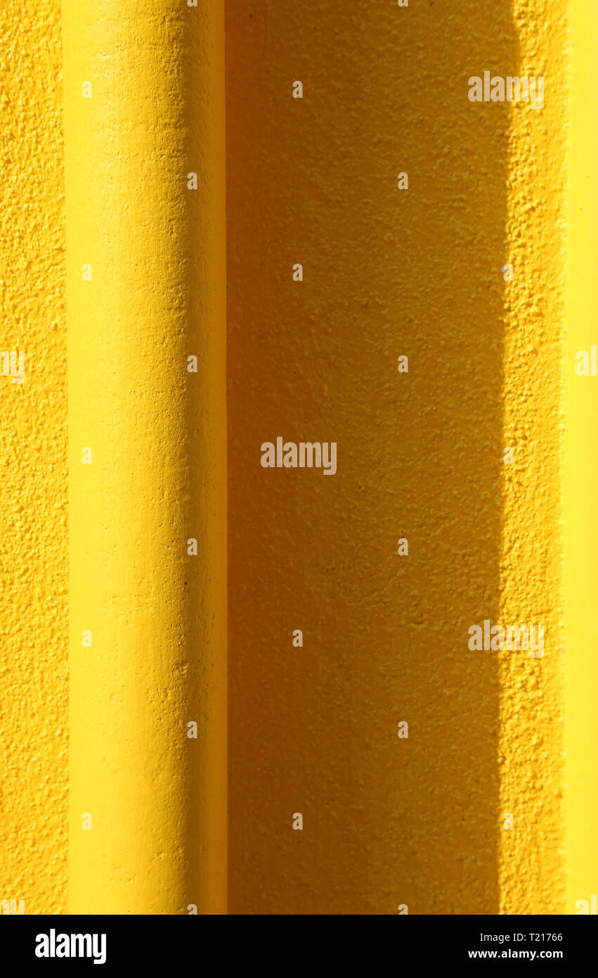yellow gutter on the yellow wall of an house Stock Photo - Alamy