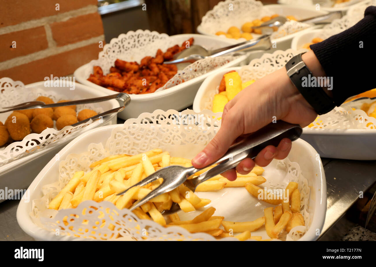 Inside a self service restaurant with many raw and cooked foods Stock ...