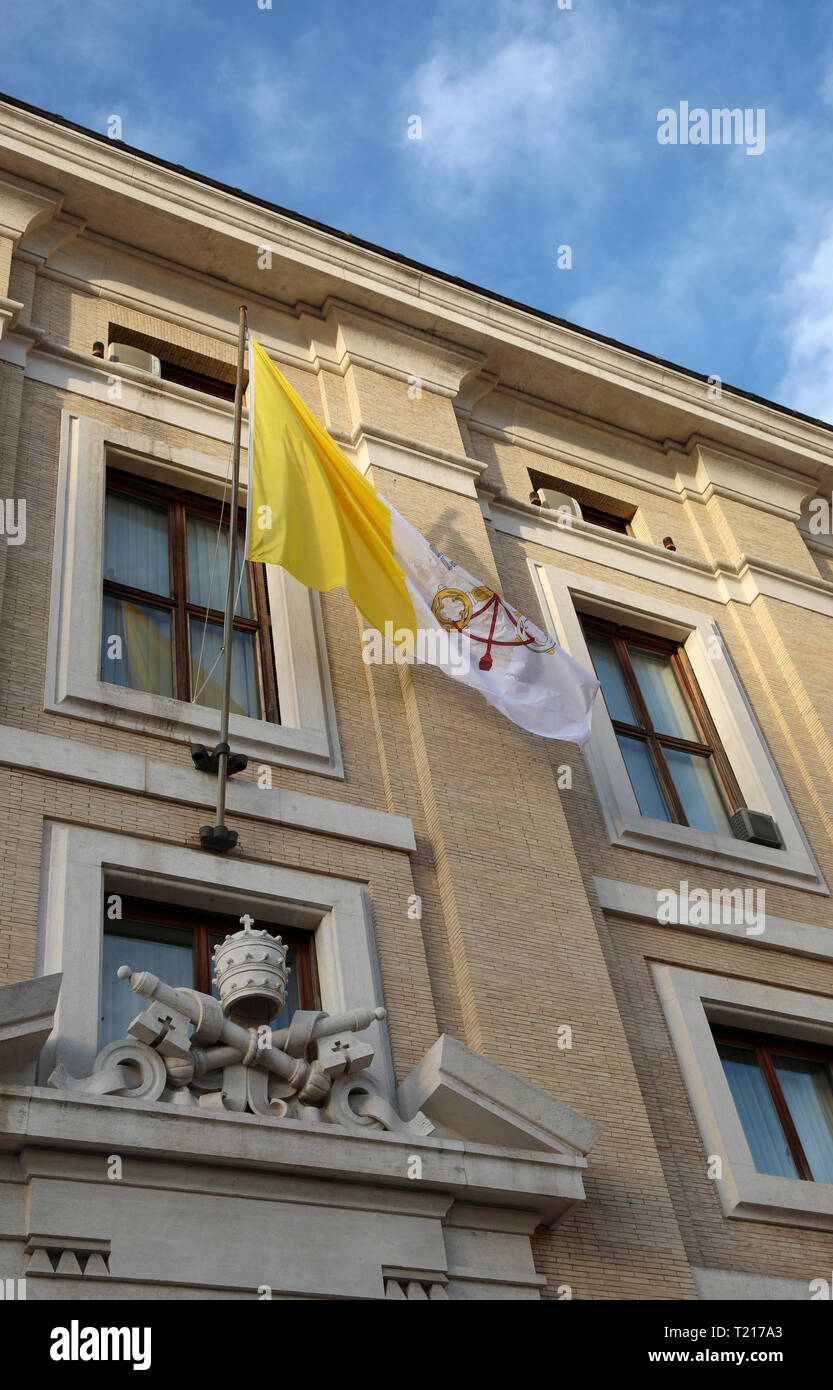 waving flag of the Vatican papal state with the symbol of the two ...