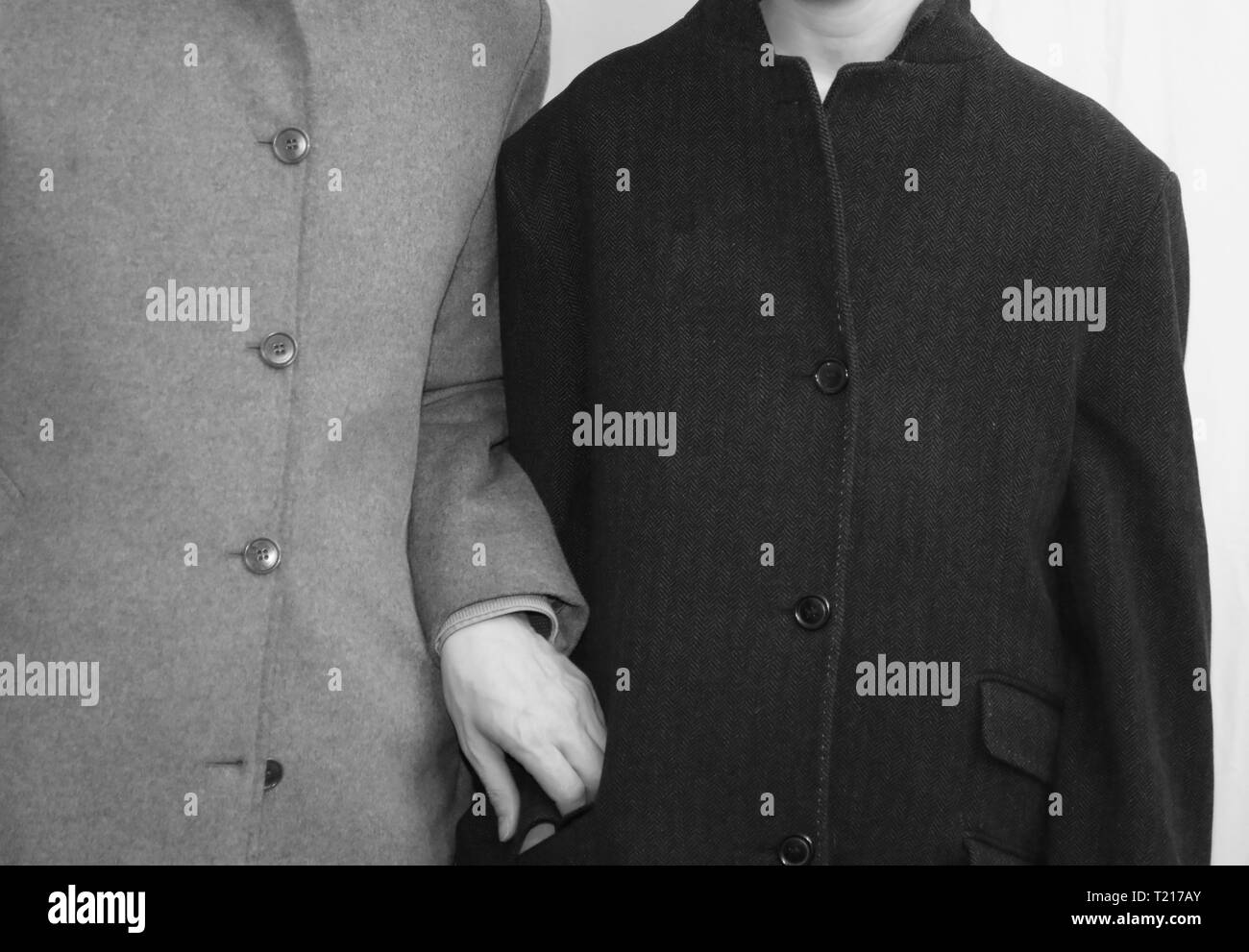 very poor family with father and son with the old threadbare coats ...