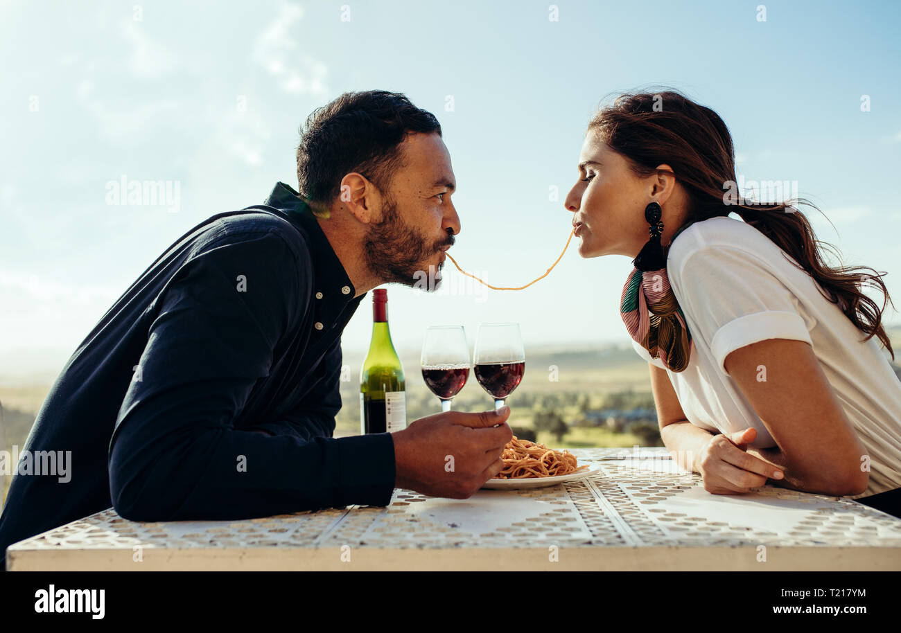 Young woman eating pasta restaurant hi-res stock photography and images ...