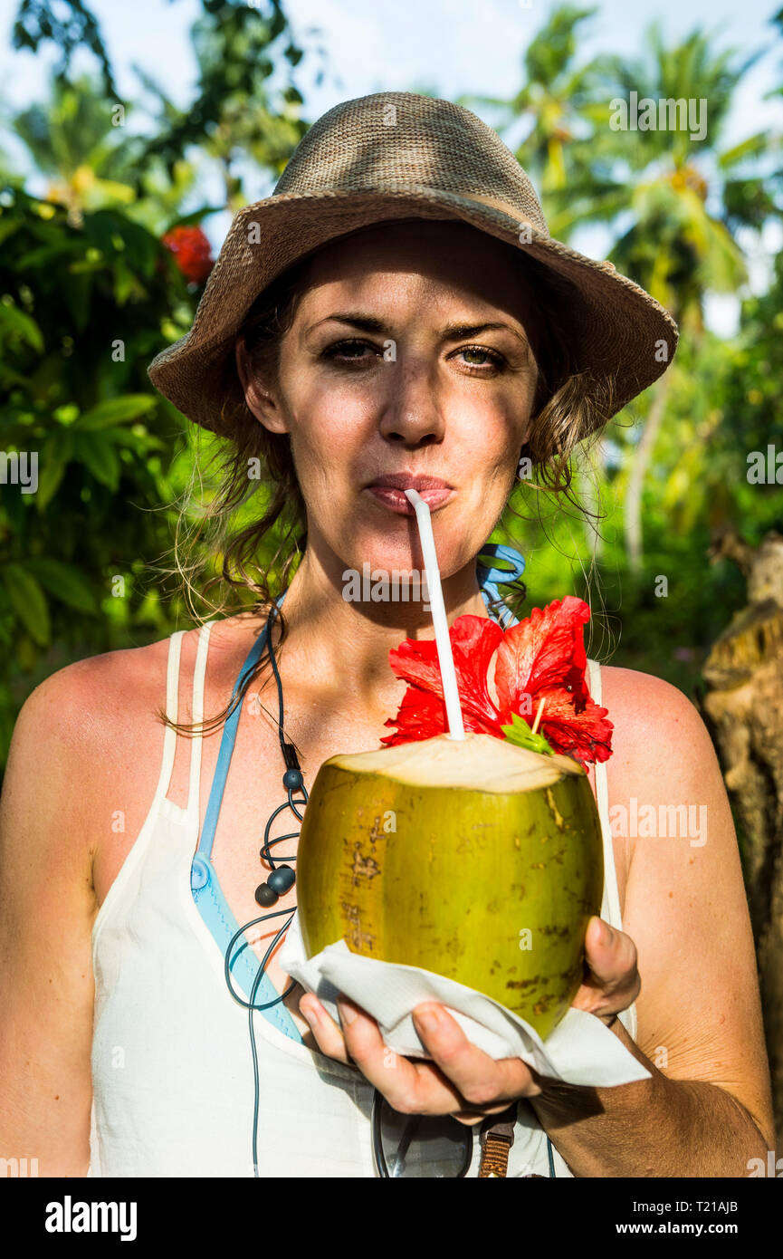 Portrait woman drinking fresh coconut water hi-res stock photography ...