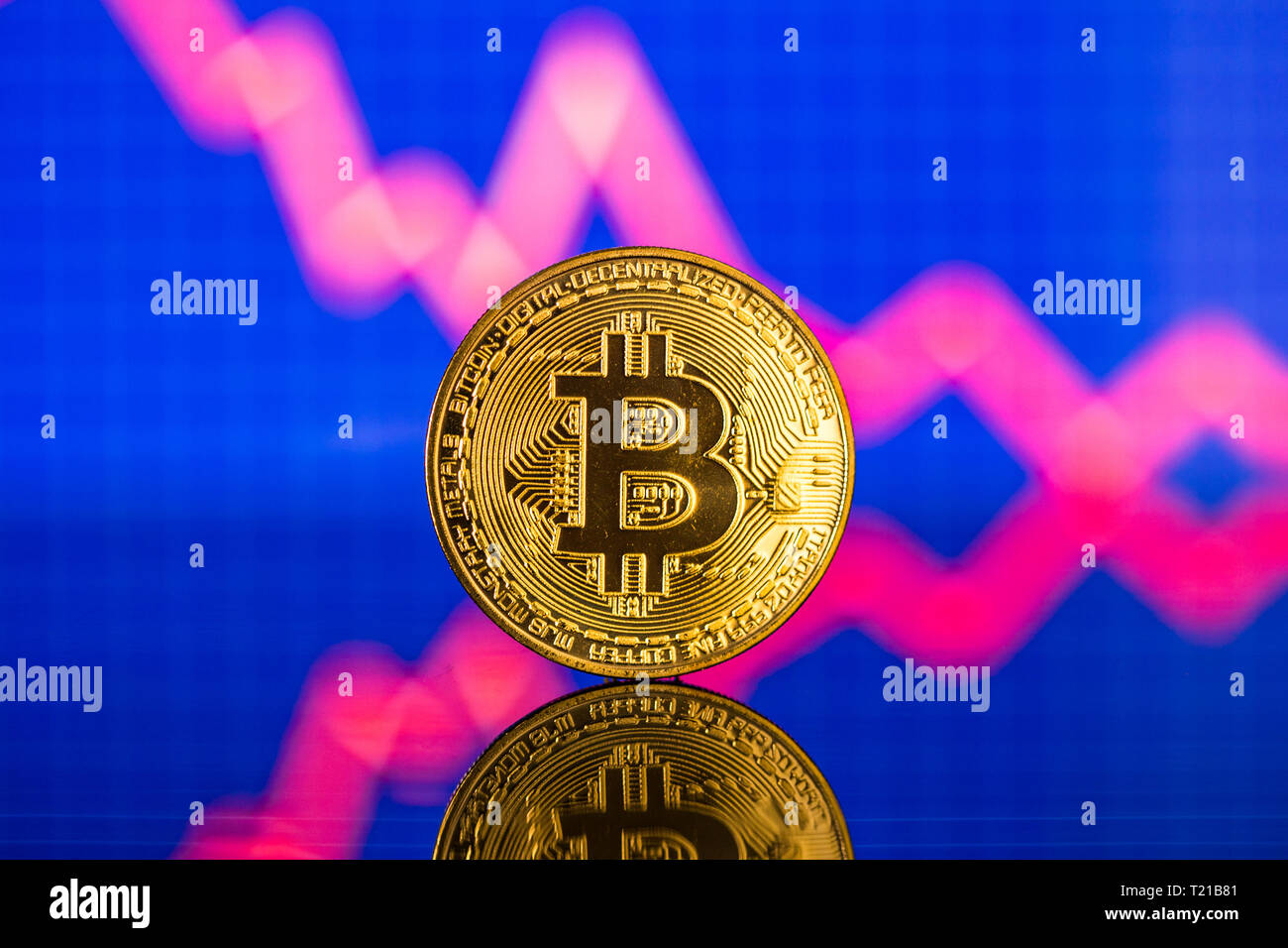 Bitcoin physical coin symbol with downtrend price graph background ...