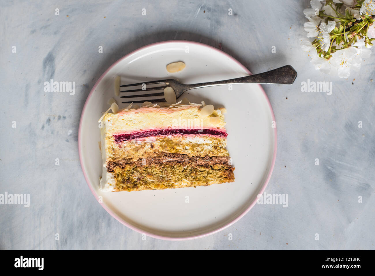 Overhead view of a slice of chocolate mousse cake on a white plate ...