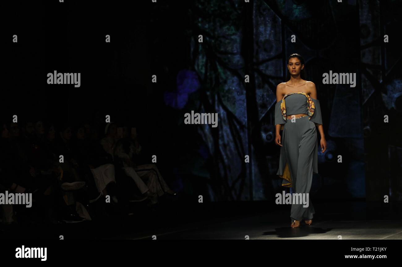 Amman, Jordan. 29th Mar, 2019. A model presents a creation at the ...