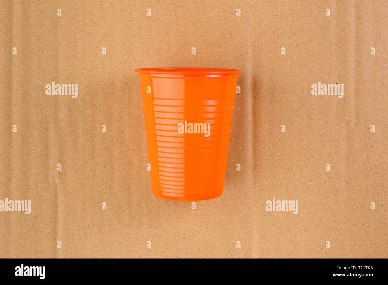 Cardboard sheet of paper,abstract texture background with plastic cup ...