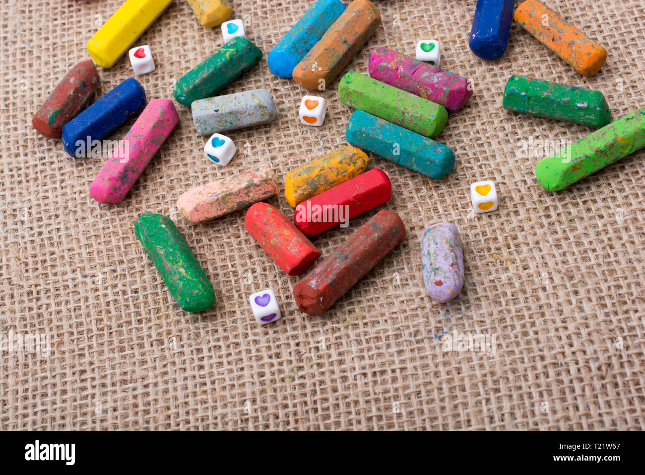 Used crayons of various color on a canvas Stock Photo - Alamy