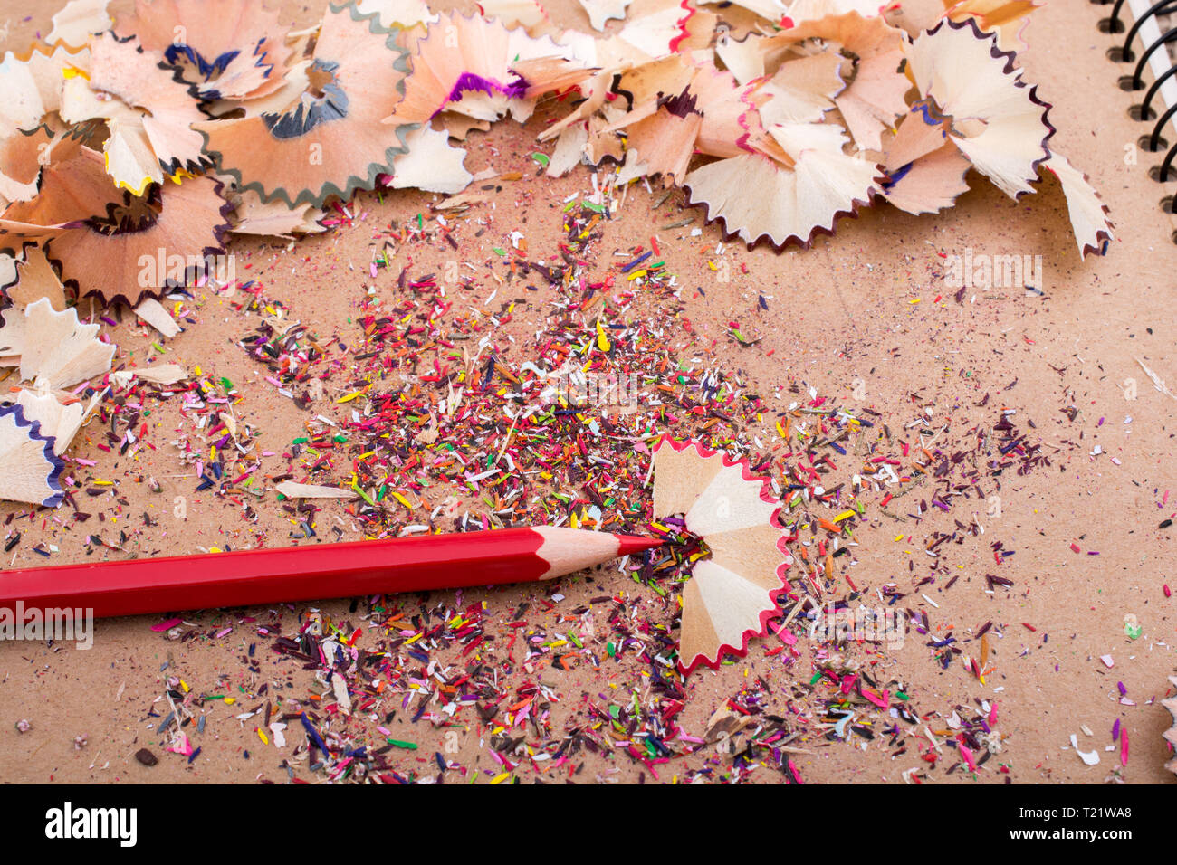 Red Color Pencil over some pencil shavings Stock Photo - Alamy