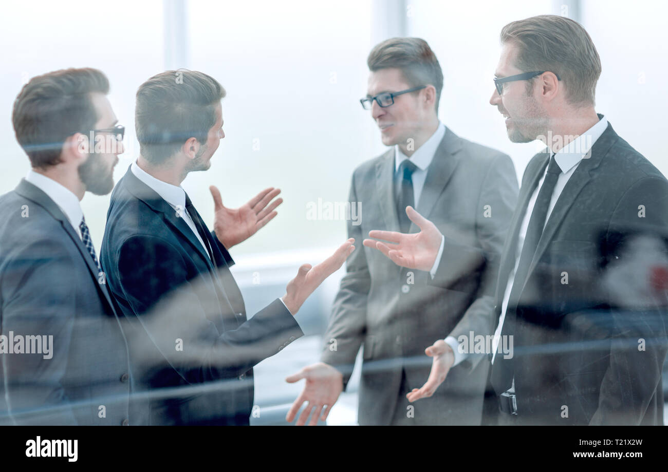 group of business people discussing common interests in the office ...