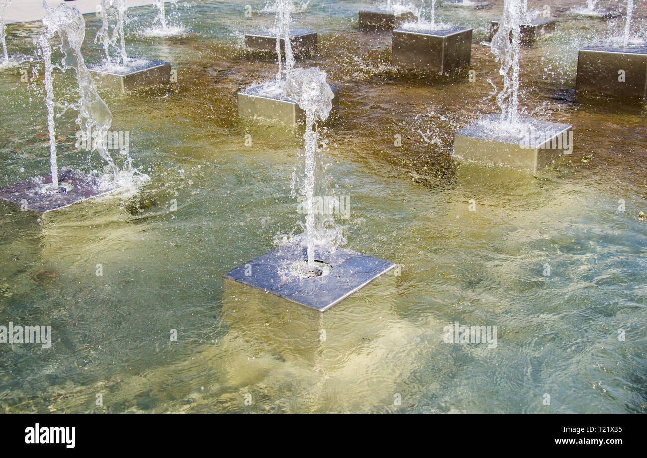 The fountains gushing sparkling water in a pool in a park Stock Photo ...