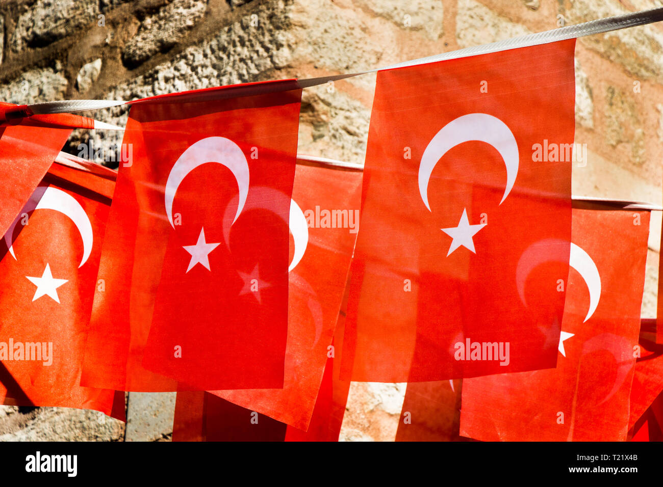 Turkish national flag hang on a pole on a rope in the street in open ...